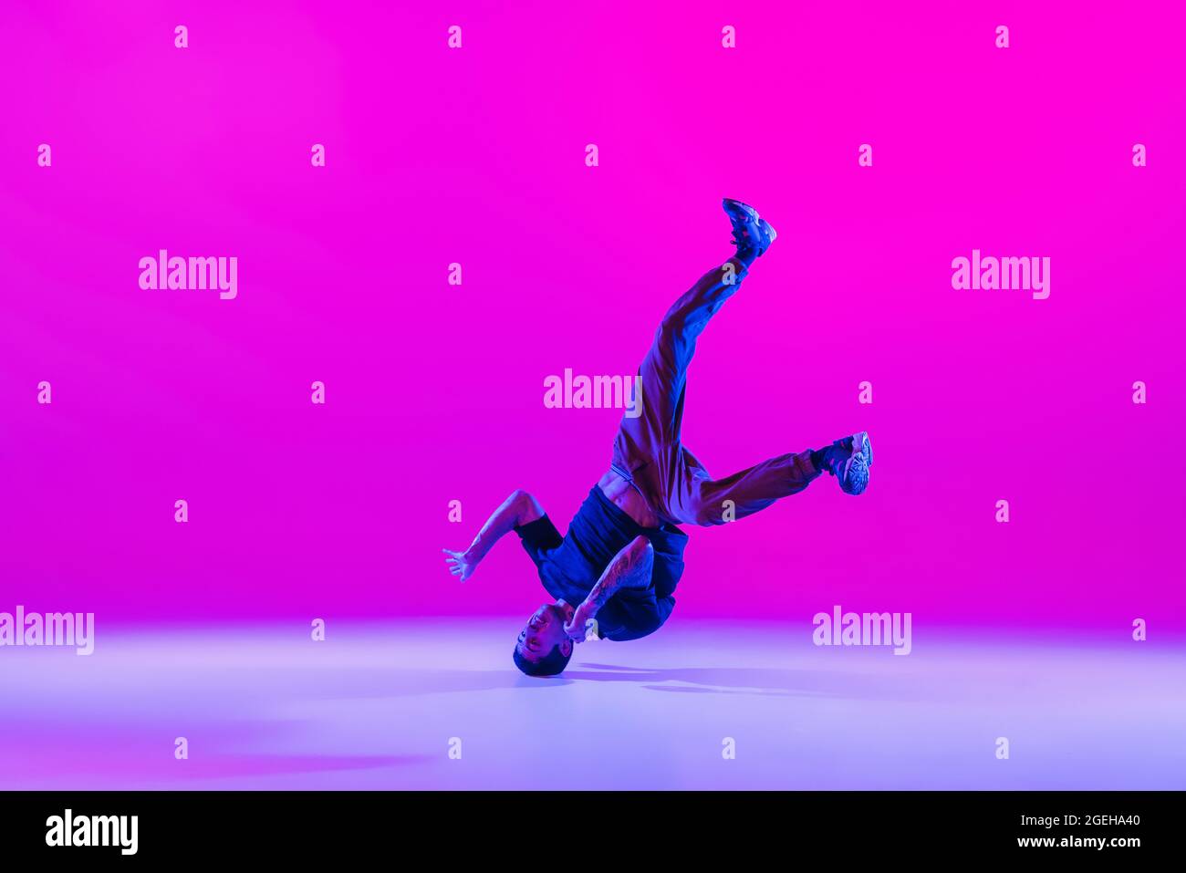 Portrait of young man, break-dance dancer dancing solo in modern ...