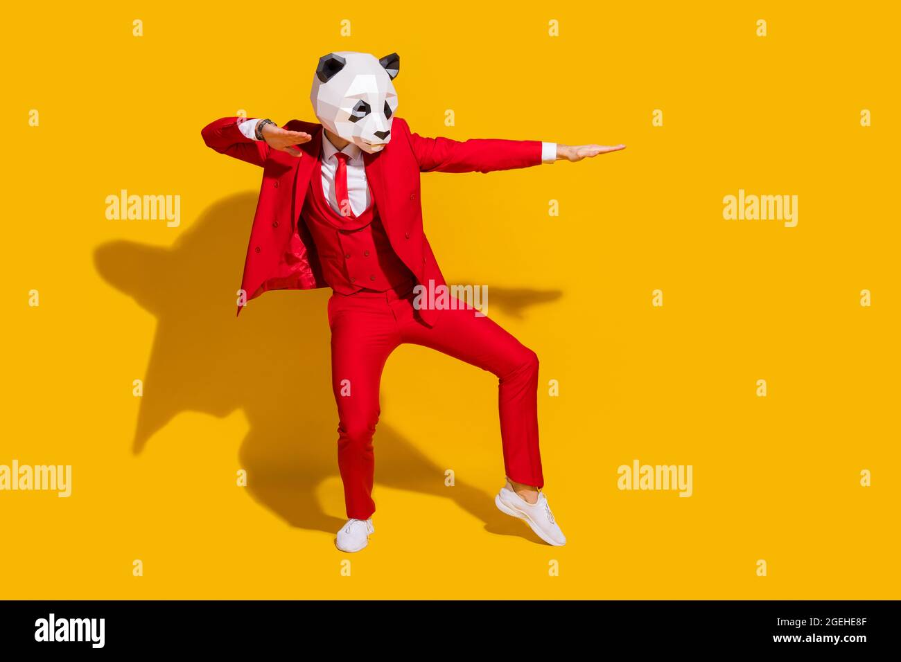 Photo of modern dancer panda guy dance move wear mask red tuxedo tie ...