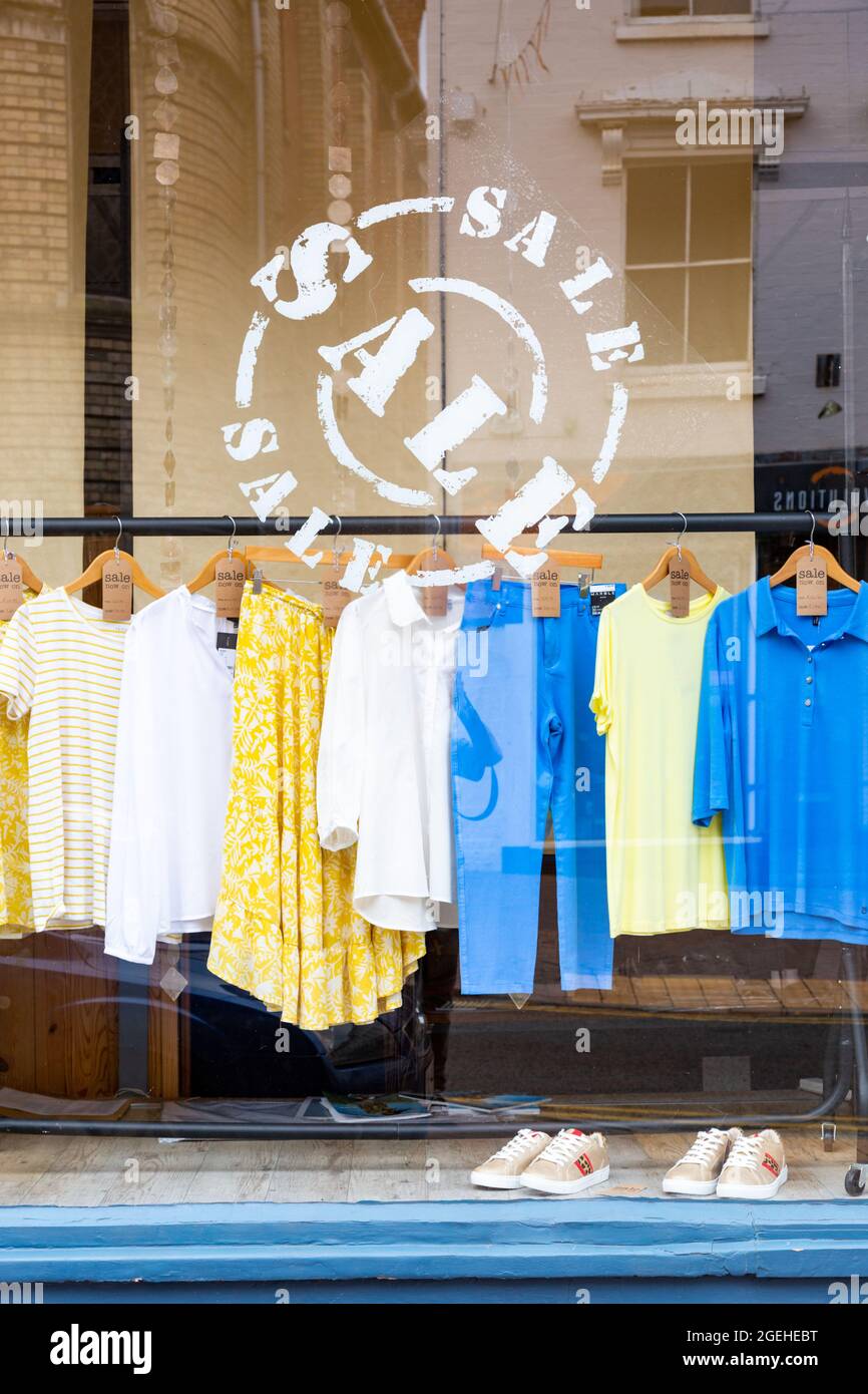 Clothes shop with a sale on, UK 2021 Stock Photo - Alamy