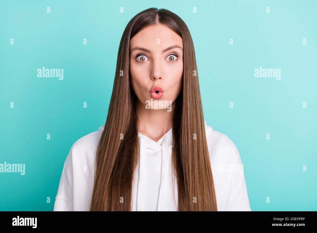 Portrait of attractive amazed long-haired girl pout lips staring eyes ...