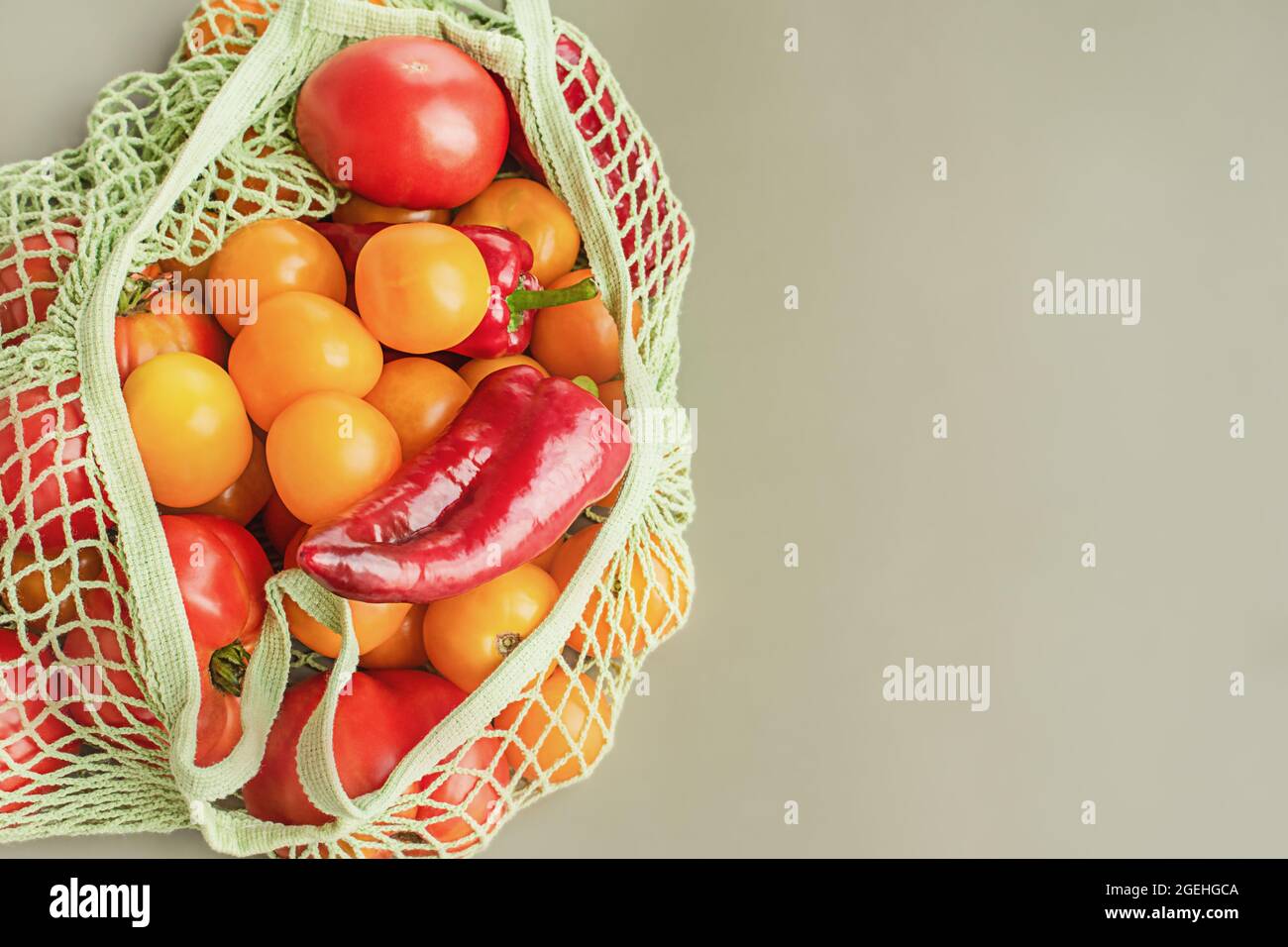 Food delivery in green packaging. Vegetables in a grid. ecological bag ...