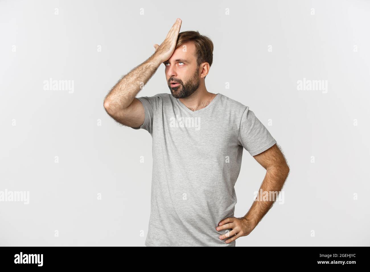 Image of annoyed guy in gray t-shirt, slap forehead and rolling eyes ...
