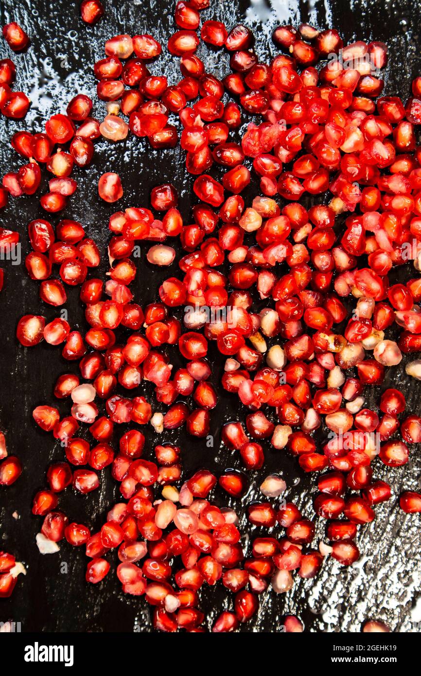 Fruit of the autumn season the red seed of the pomegranate Stock Photo ...
