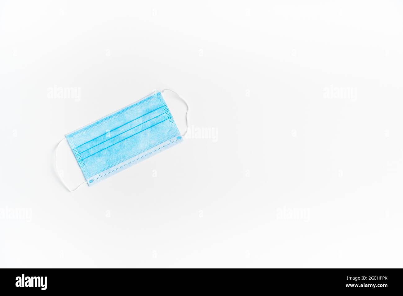 Surgical mask with rubber ear straps. Typical 3-ply surgical mask to ...