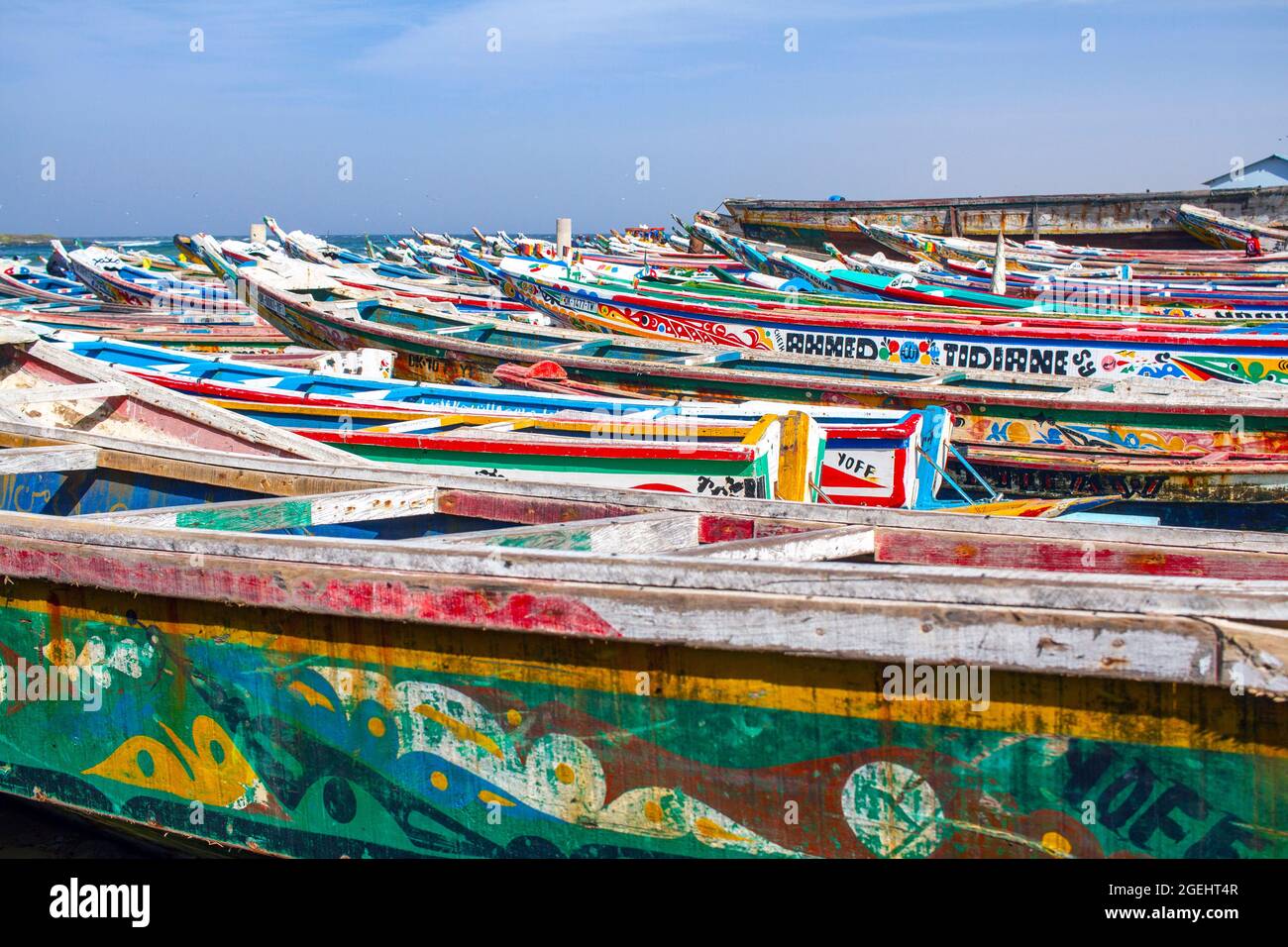 COLOURFUL AFRICAN BOATS ARE STORED ON THE BEACH Stock Photo - Alamy