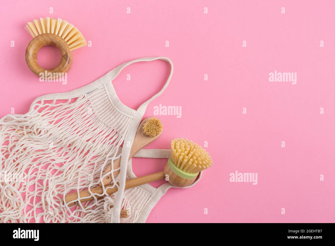 Eco-friendly kitchen accessories on pink background. The concept zero ...