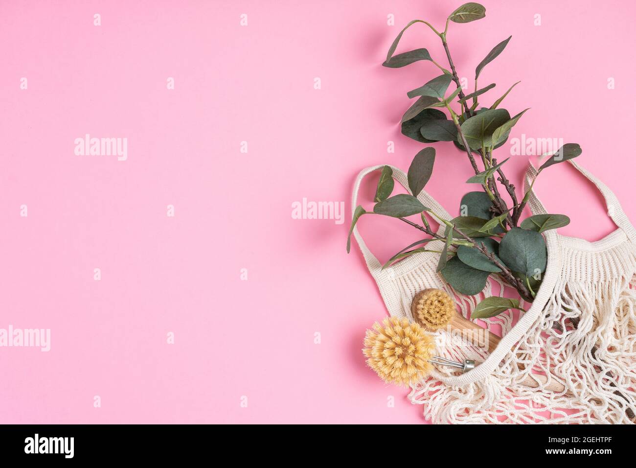 Eco-friendly kitchen accessories on pink background. The concept zero ...