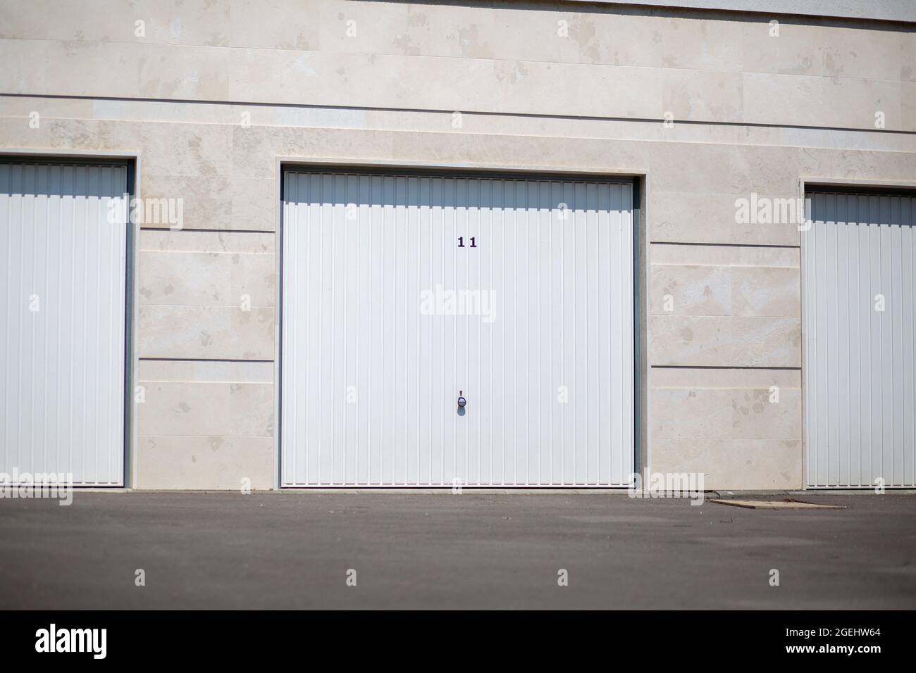 Closeup of a garage with white gates Stock Photo - Alamy