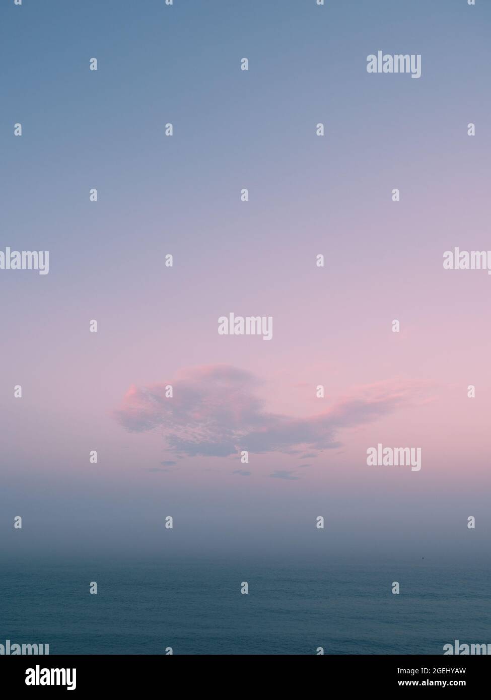 A view of a pink colored cloud over the Atlantic Ocean off the coast of ...