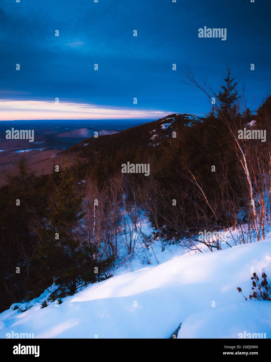 The morning sunlight shining on a ridge of Mount Monadnock as seen from ...