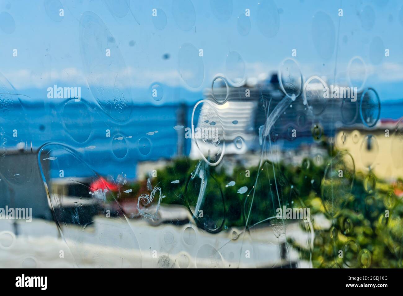 A view of the Seattle waterfront through a warped window Stock Photo ...