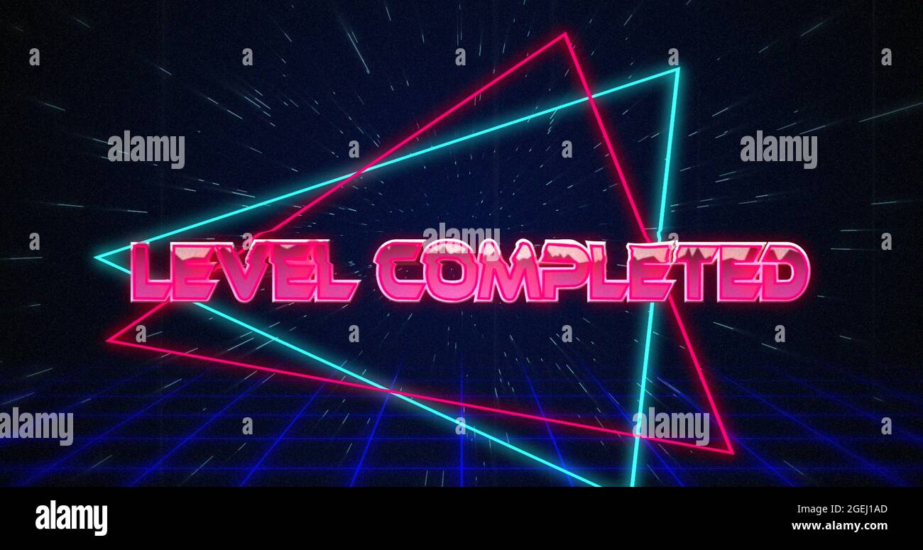 Retro Level Completed text glitching over blue and red triangles on ...