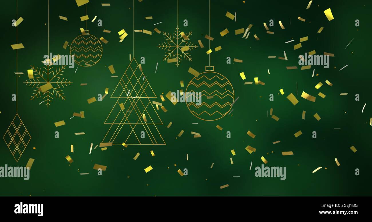 Digital image of golden confetti falling over christmas decorations ...