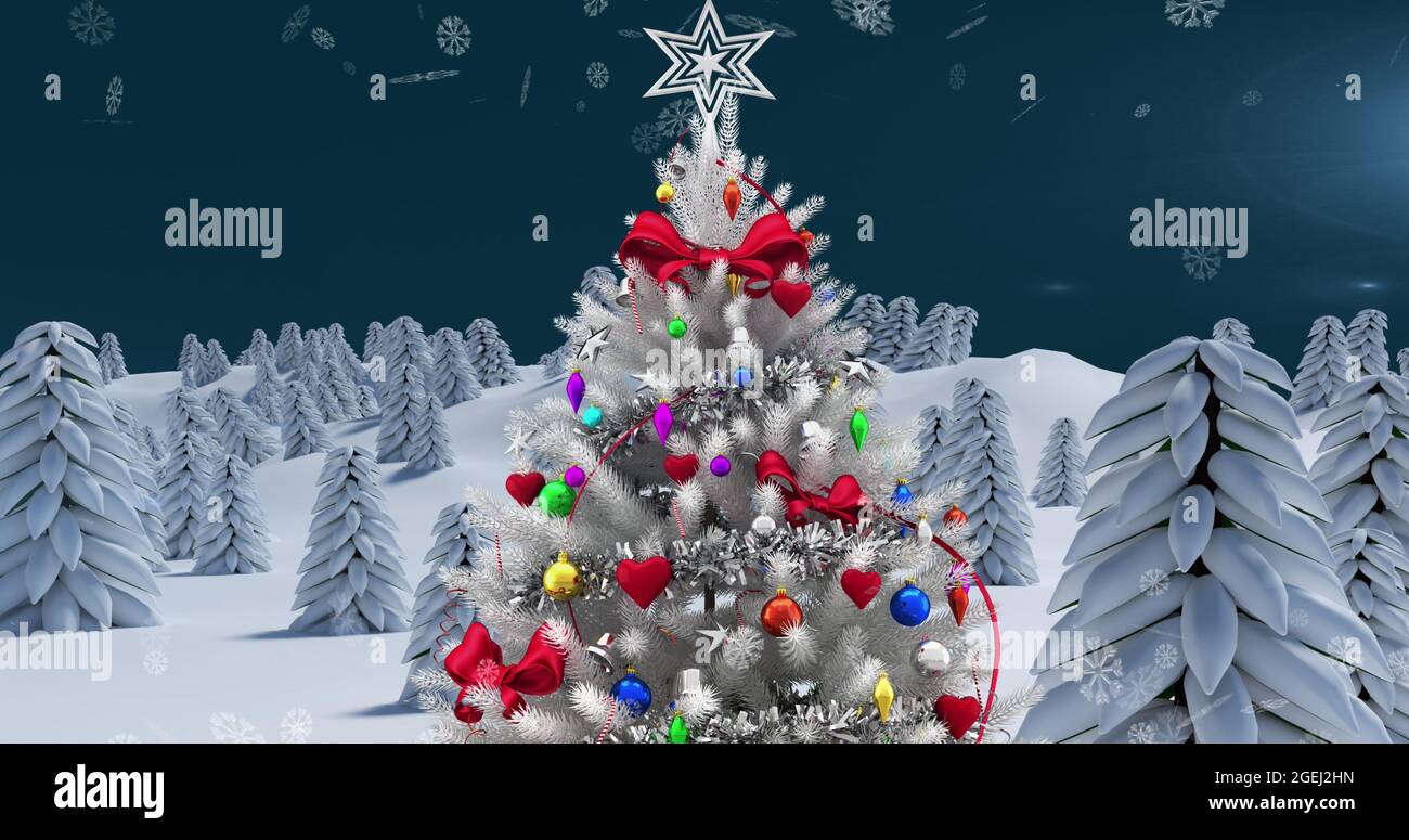 Image of christmas tree and winter scenery with snow falling seen ...