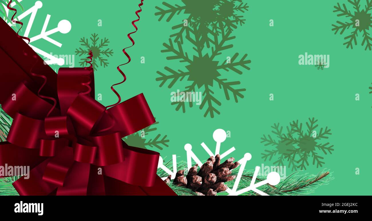Image of red present ribbon and snow falling on green background Stock ...