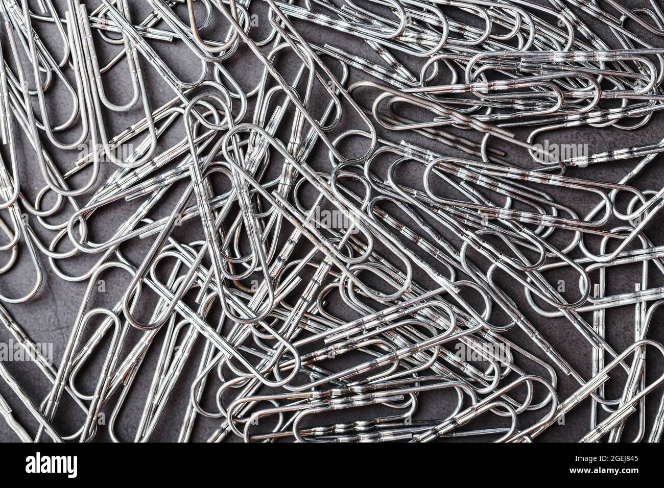 Silver paper clips textured background, full screen Stock Photo - Alamy