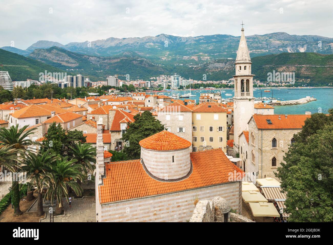 Landscape of Old town Budva: Ancient walls and red tiled roof ...