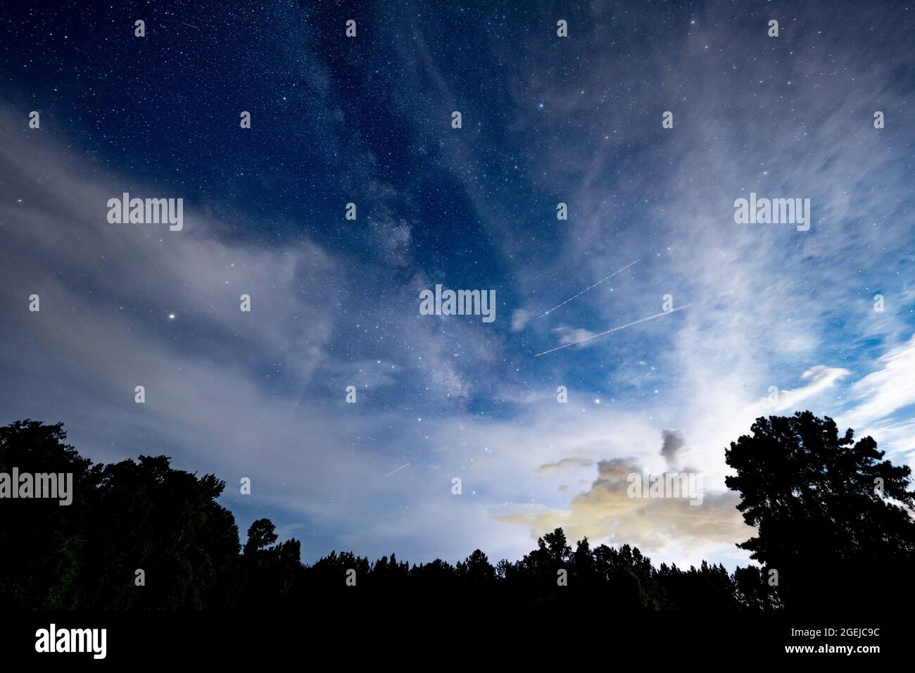 Long exposure stars in sky with clouds Stock Photo - Alamy