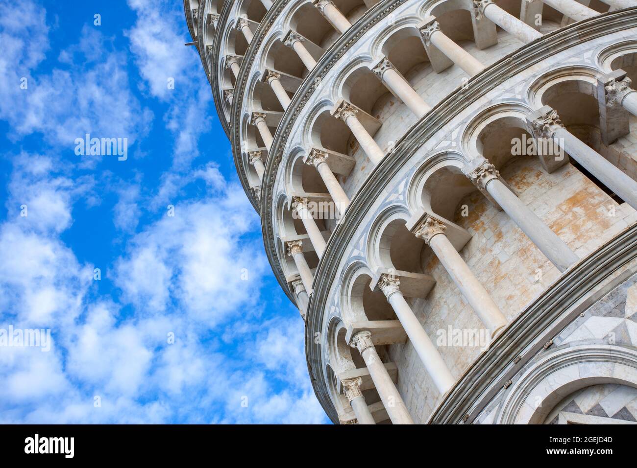 Part of the Leaning Tower of Pisa and copy space on the blue sky with ...