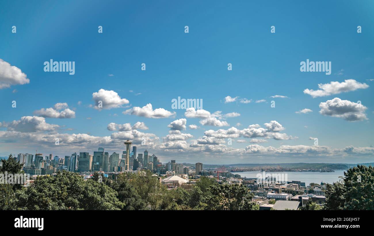 Panoramic view of the Seattle Skyline With Bright Skies and Low Clouds ...