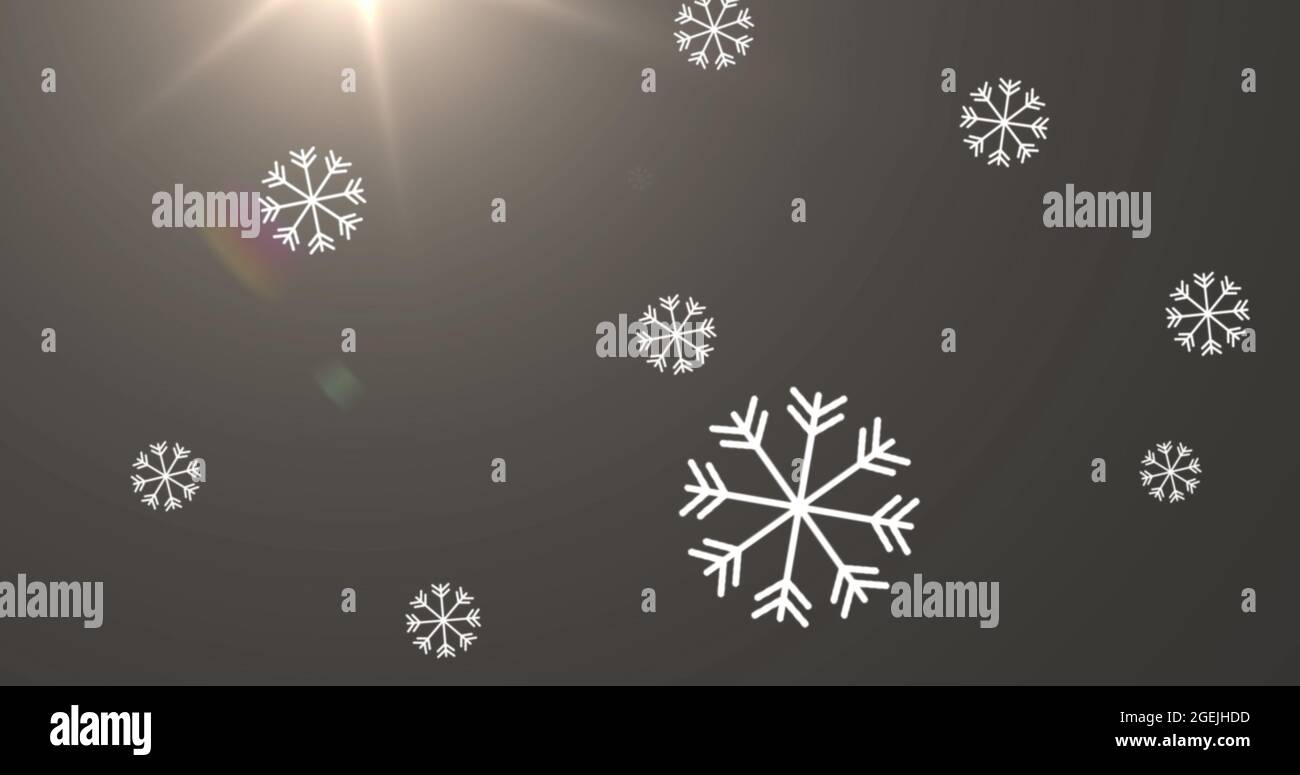 Digital image of snowflakes and christmas fits falling against bright ...