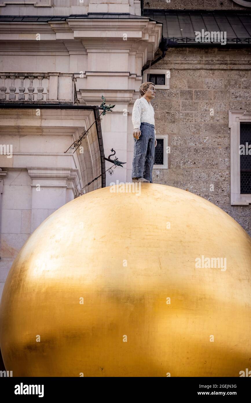Man on a golden Sphere Sculpture in Salzburg - SALZBURG, AUSTRIA ...