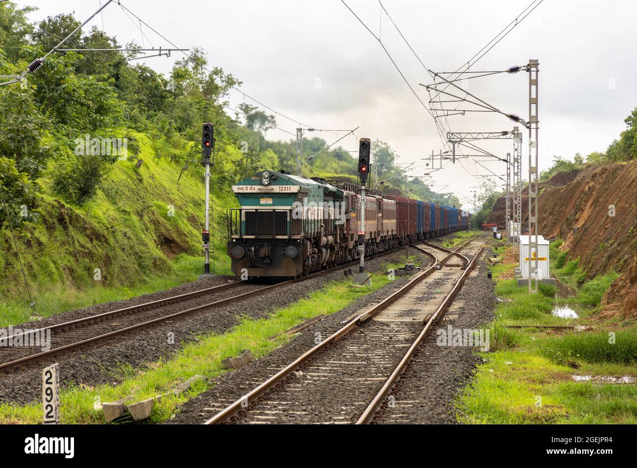Freight train led by WDG-4 diesel locomotive and two dead electric ...