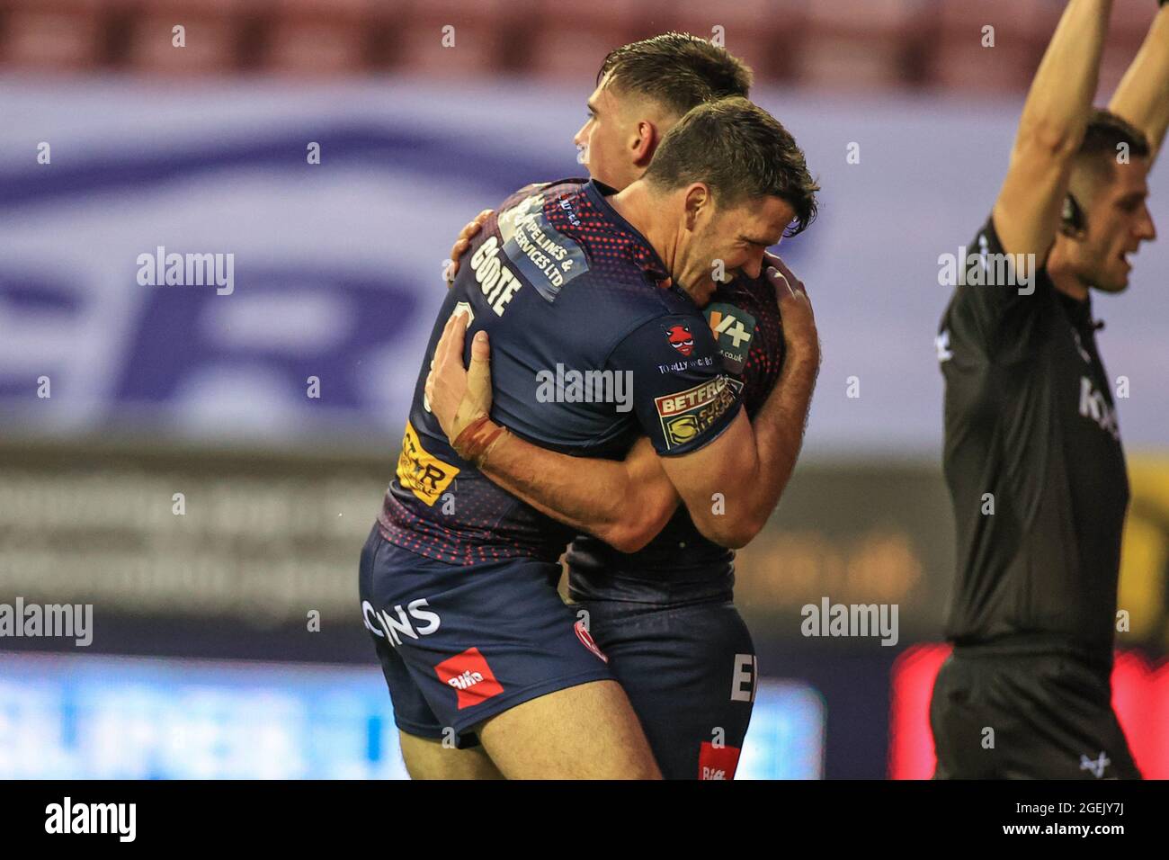 Lewis Dodd (21) of St Helens celebrates his try with Lachlan Coote (1 ...