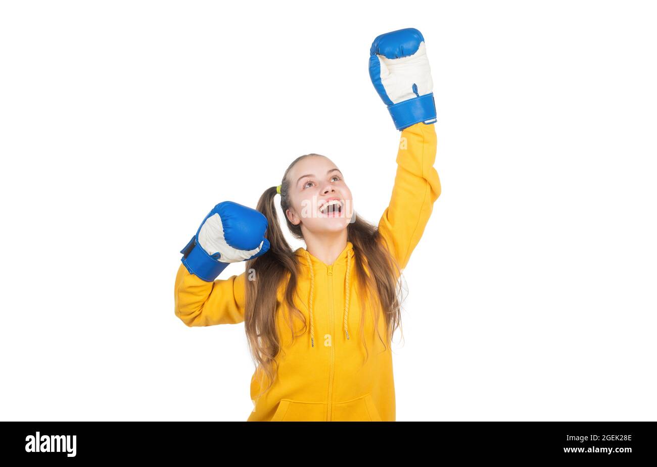 happy kid boxer in boxing gloves celebrating victory in fight isolated ...