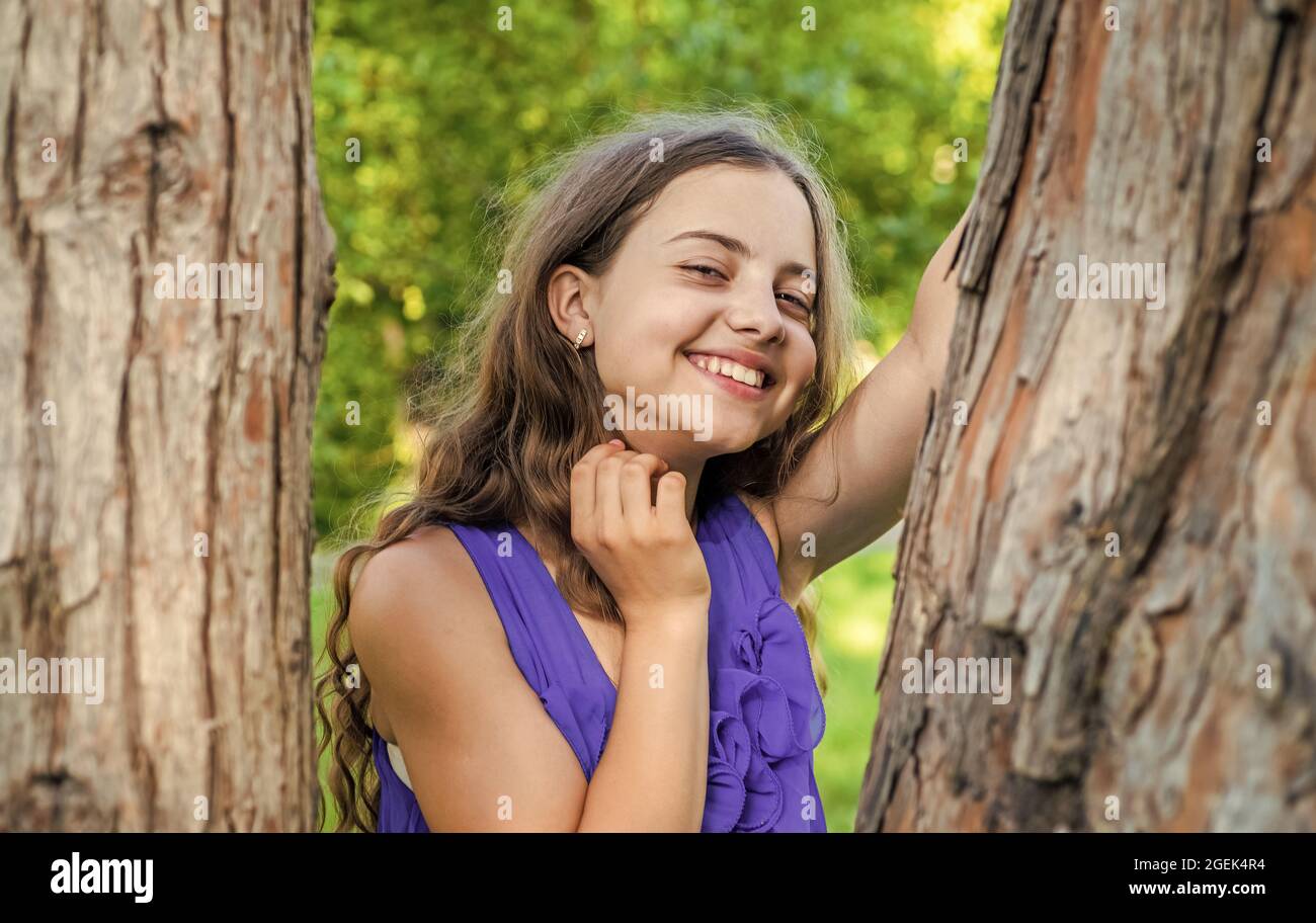 Complete teeth are awesome. Happy child smile at tree summer outdoors ...
