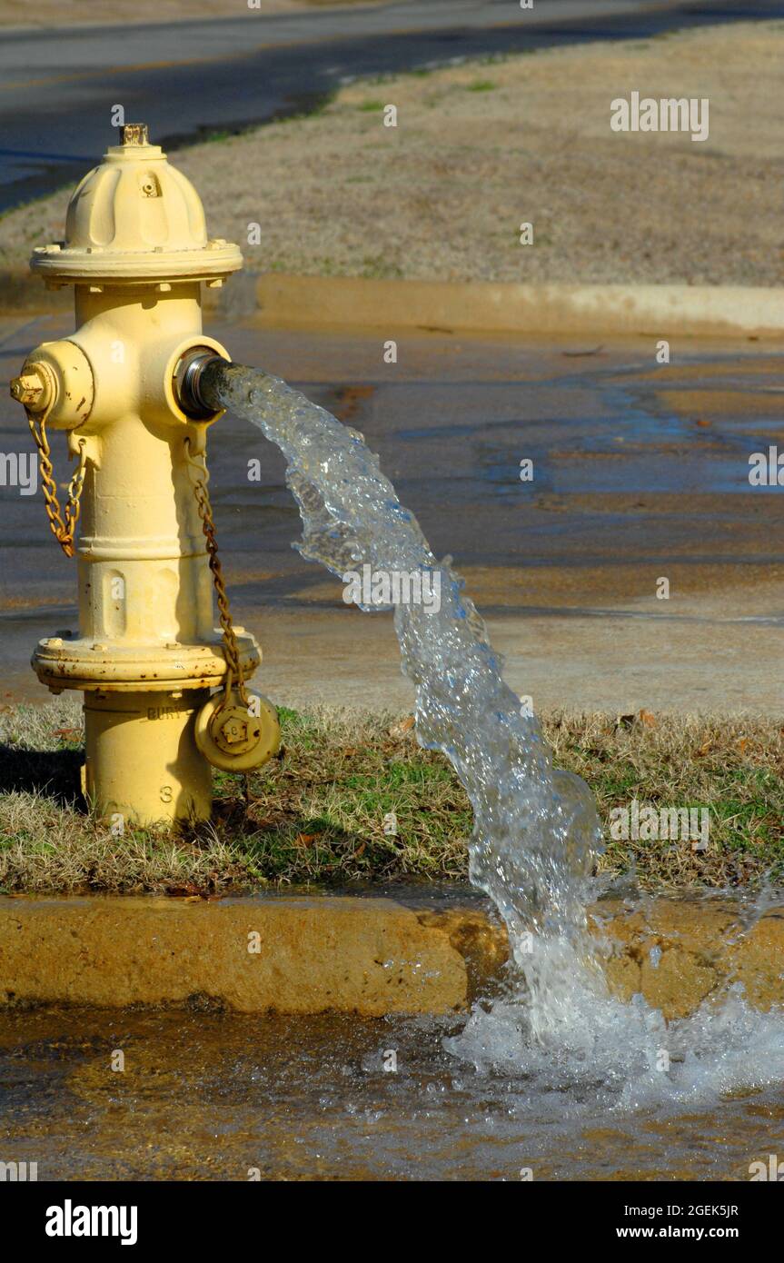 Water hydrant gushes water as lines are flushed in a town in Arkansas ...