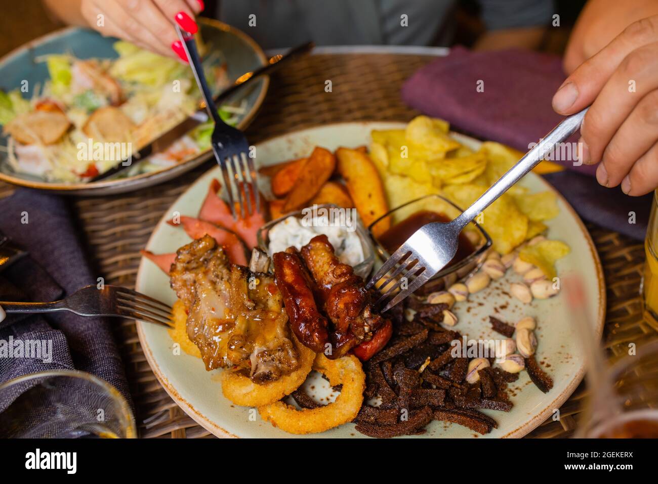 Young woman eating pork steak hi-res stock photography and images - Alamy