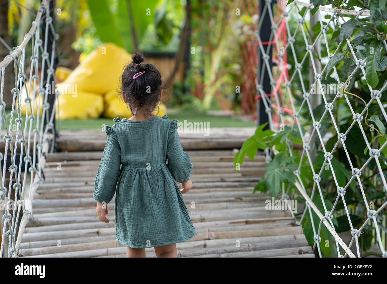 Back view of a beautiful Southeast Asian female kid Stock Photo - Alamy
