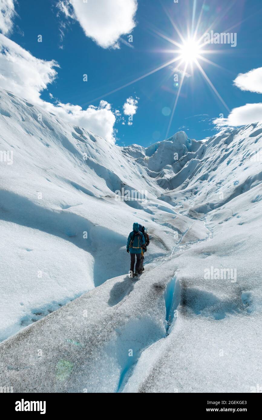 Two hikers on ice hike route of Perito Moreno Glacier Stock Photo - Alamy