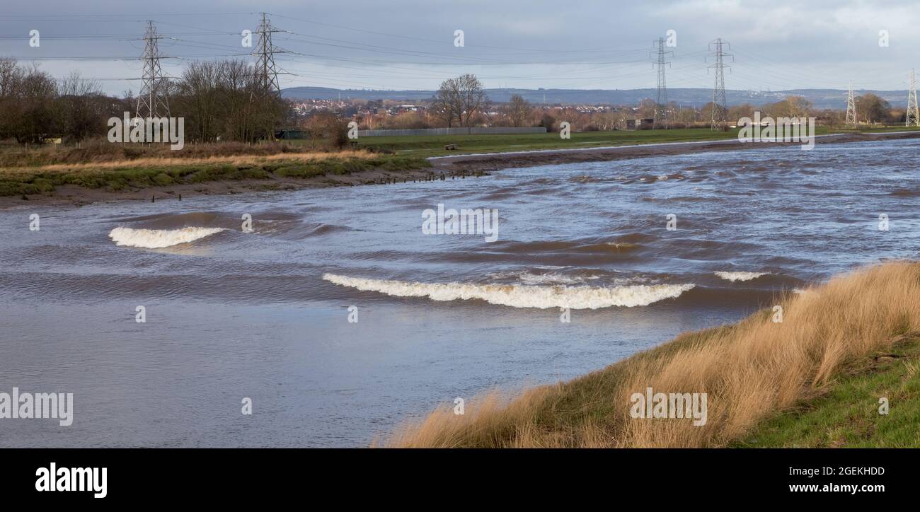 The Dee Tidal Bore near Queensferry in Flinshire, Wales, travels inland ...