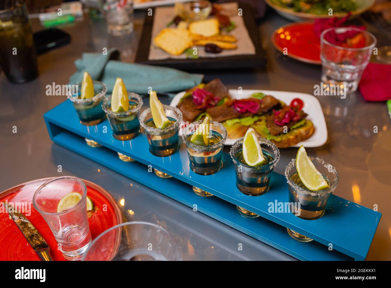Barman make alcoholic shots with rum and liquor Stock Photo - Alamy