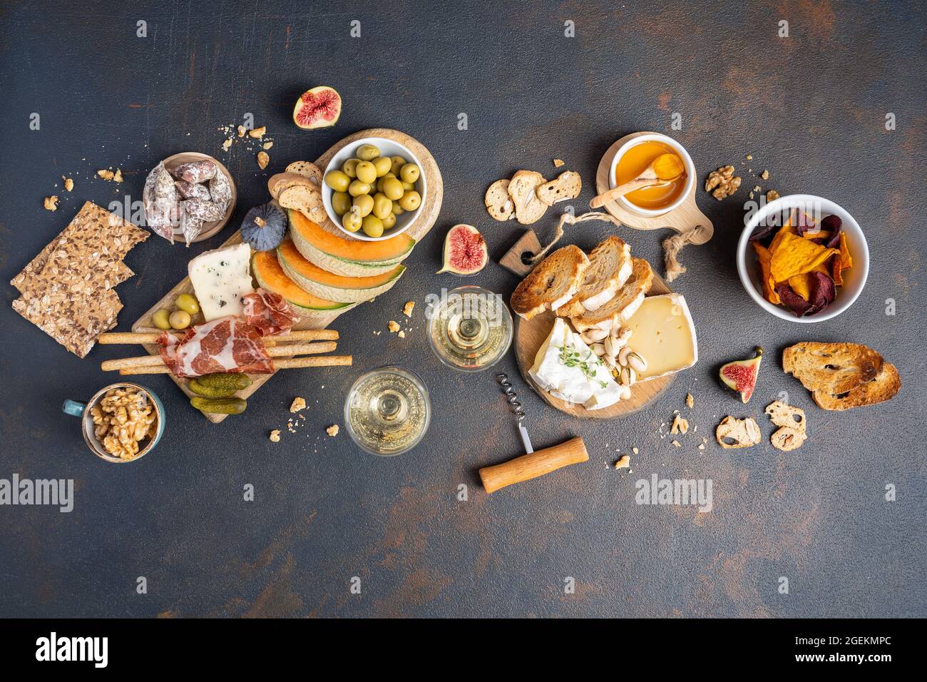 Snacks table with Italian snacks and wine in glasses. Brushetta, a kind ...