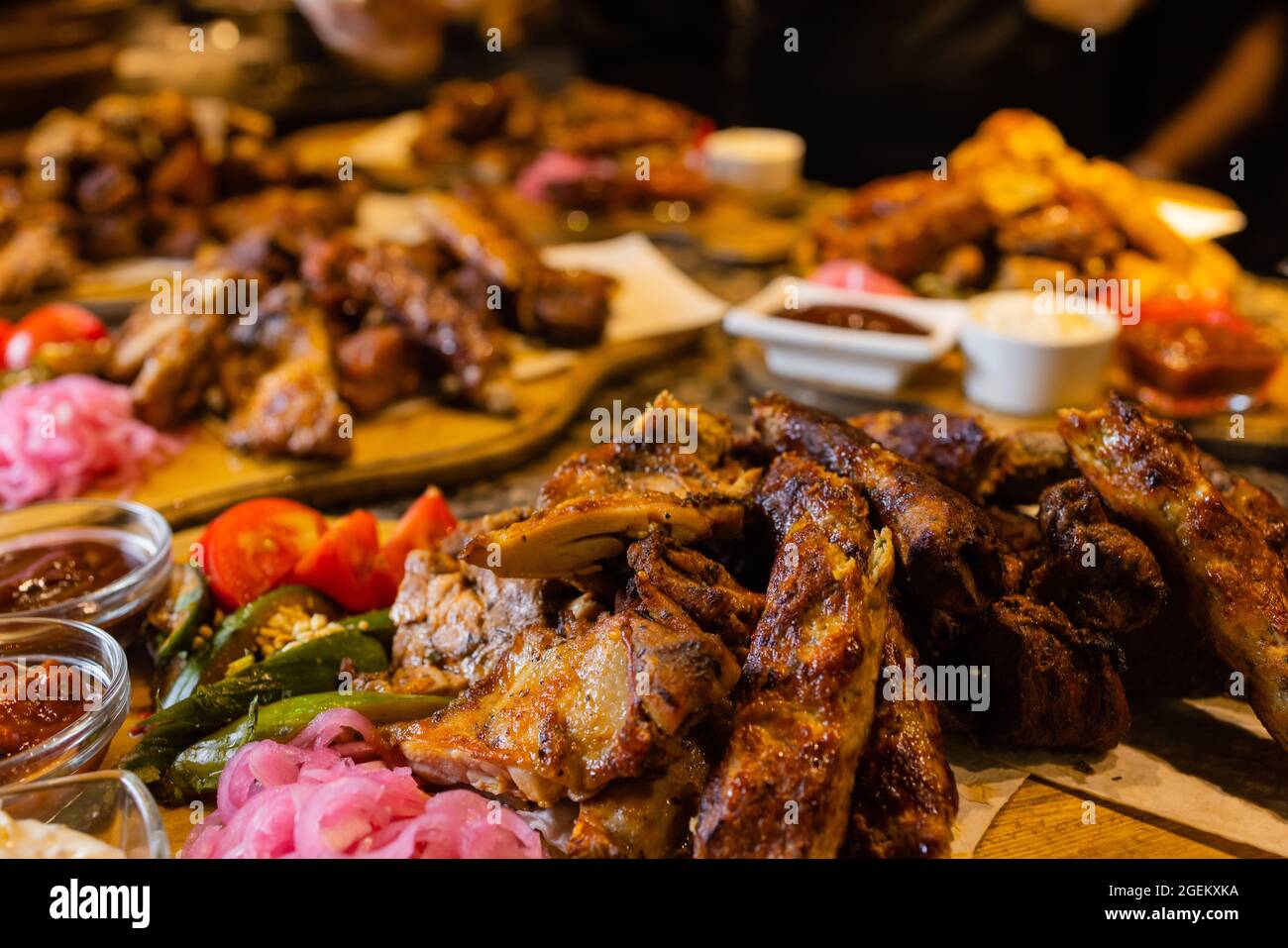 Assorted meat on a plate close up. Different types of meat and potatoes ...