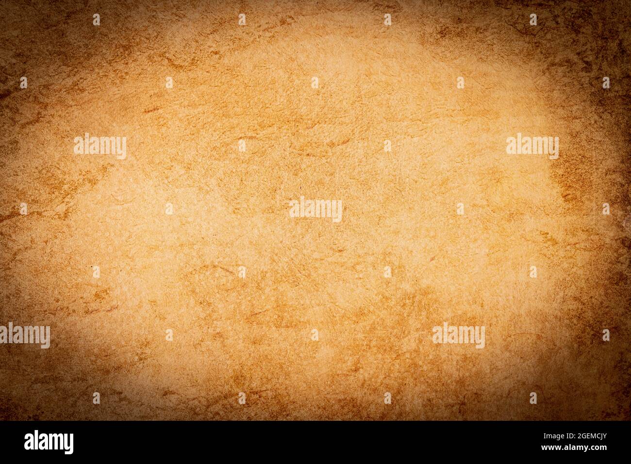 A sheet of blank, aged parchment paper for use as a background with ...