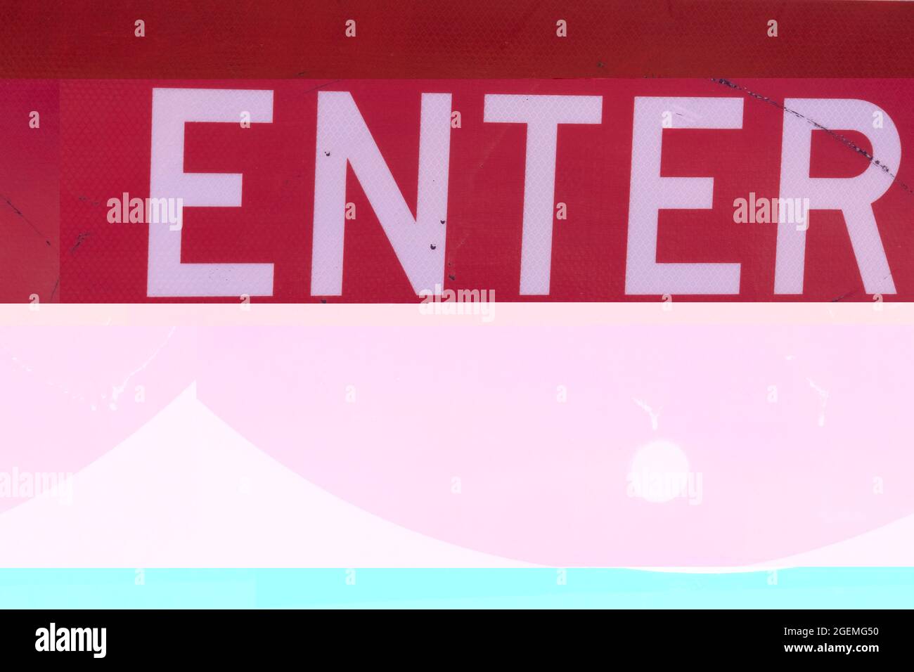 Wrong way do not enter sign posted over on the side of the road Stock ...