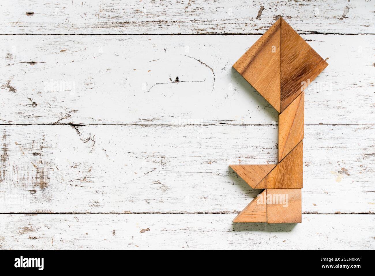 Tangram puzzle in key shape on old white wood background Stock Photo ...