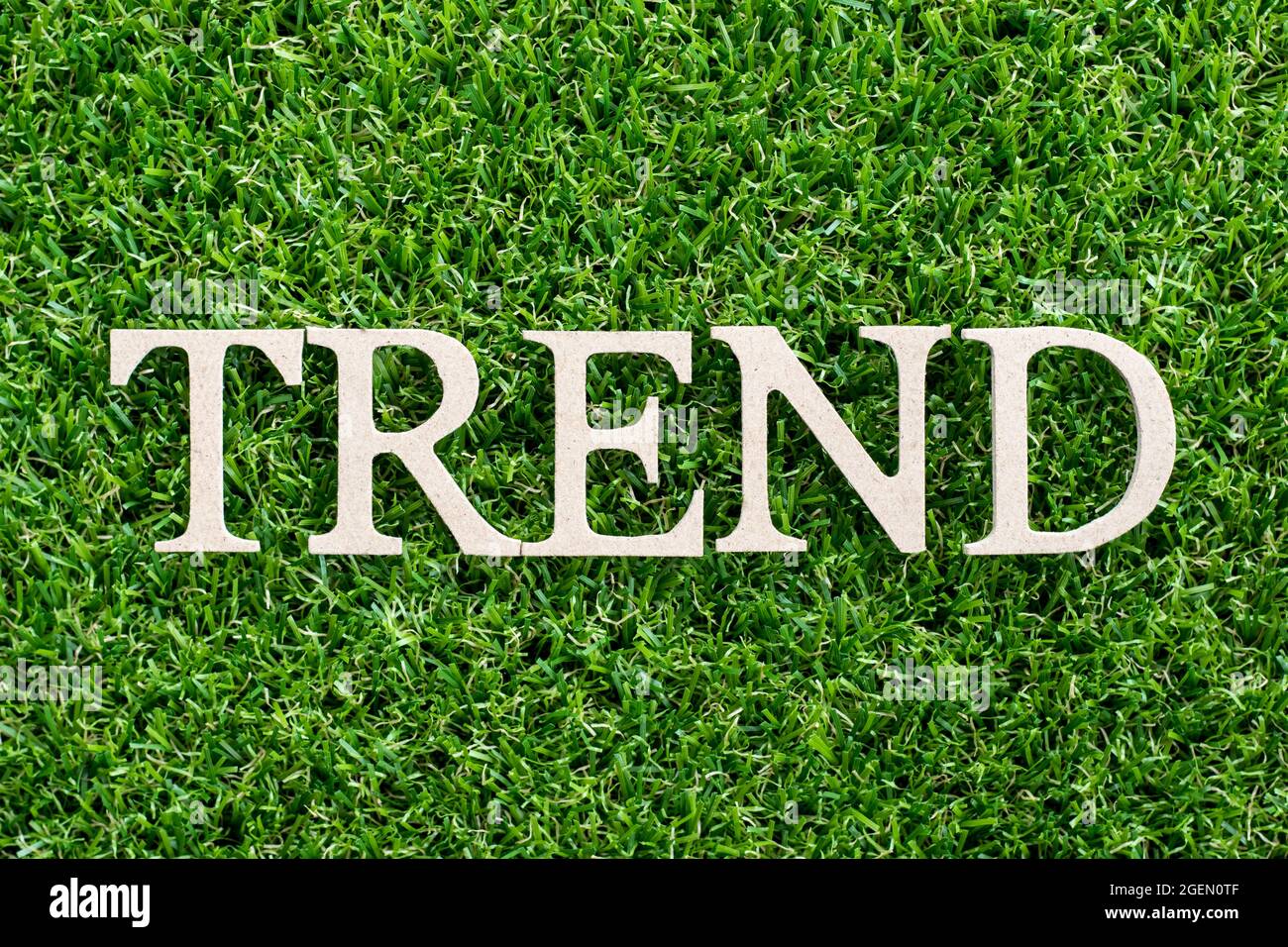 Wood letter in word trend on artificial green grass background Stock ...