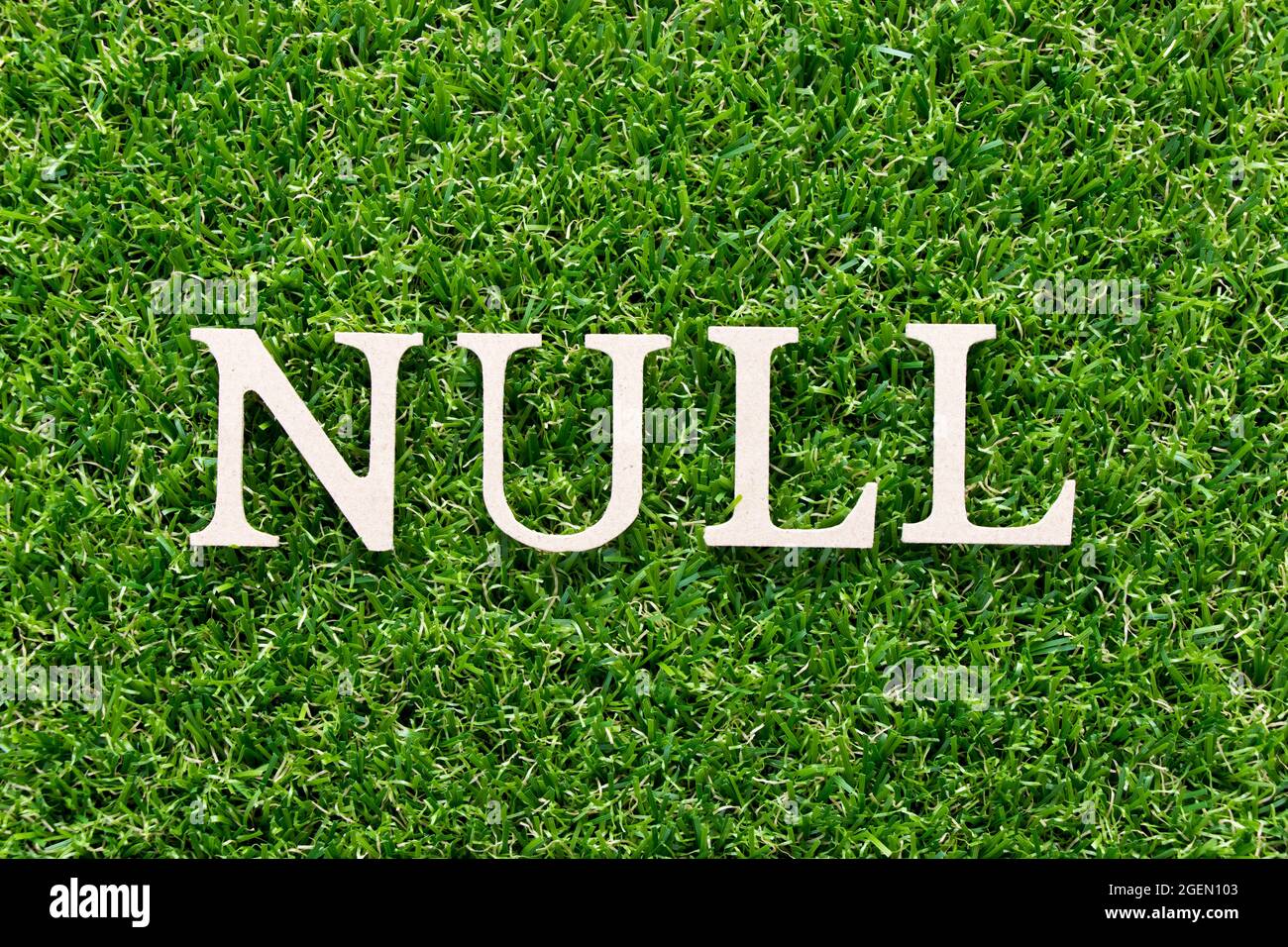Wood alphabet in word null on artificial green grass background Stock ...
