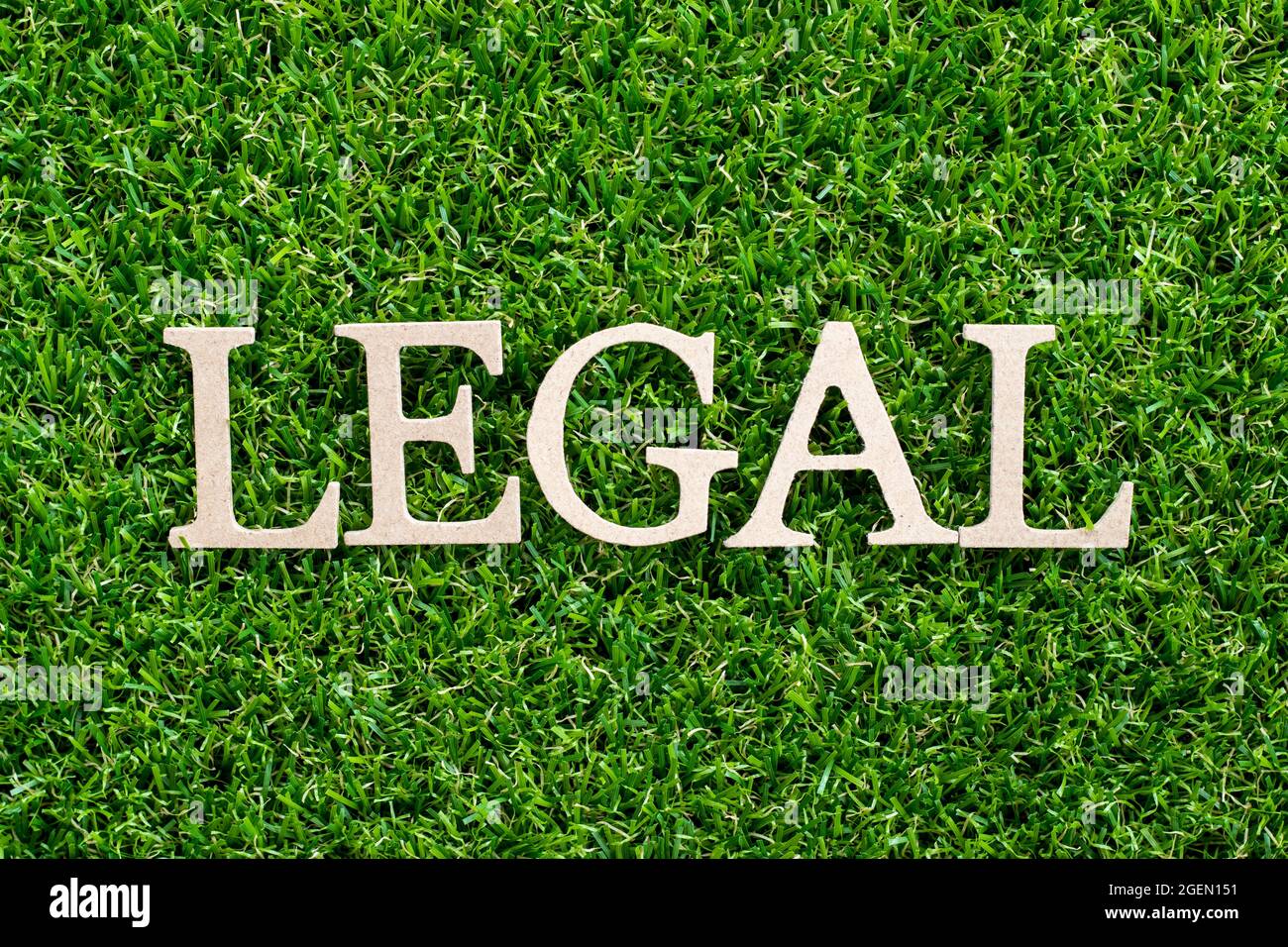 Wood letter in word legal on artificial green grass background Stock ...