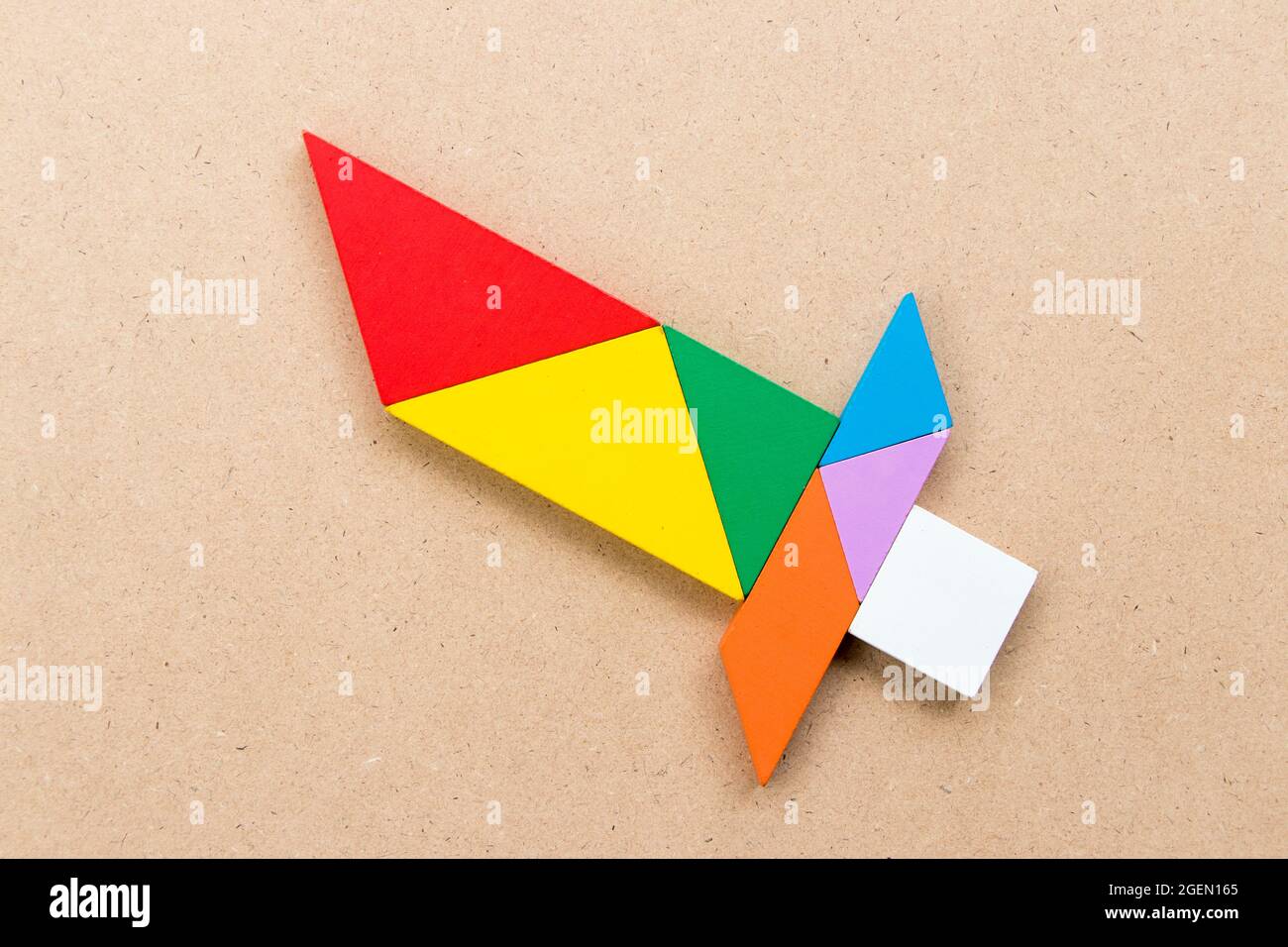 Color tangram puzzle in sword shape on wood background Stock Photo - Alamy