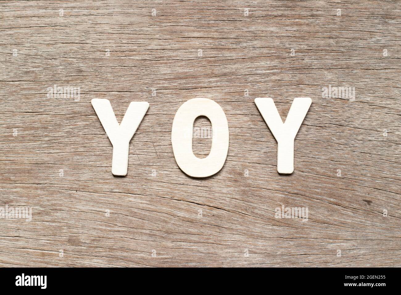 Alphabet letter in word YOY (abbreviation of year over year) on wood ...