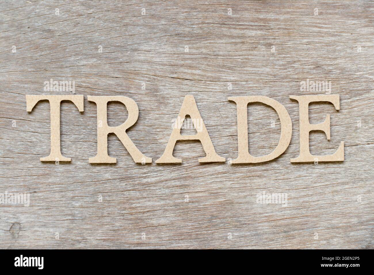 Alphabet letter in word trade on wood background Stock Photo - Alamy