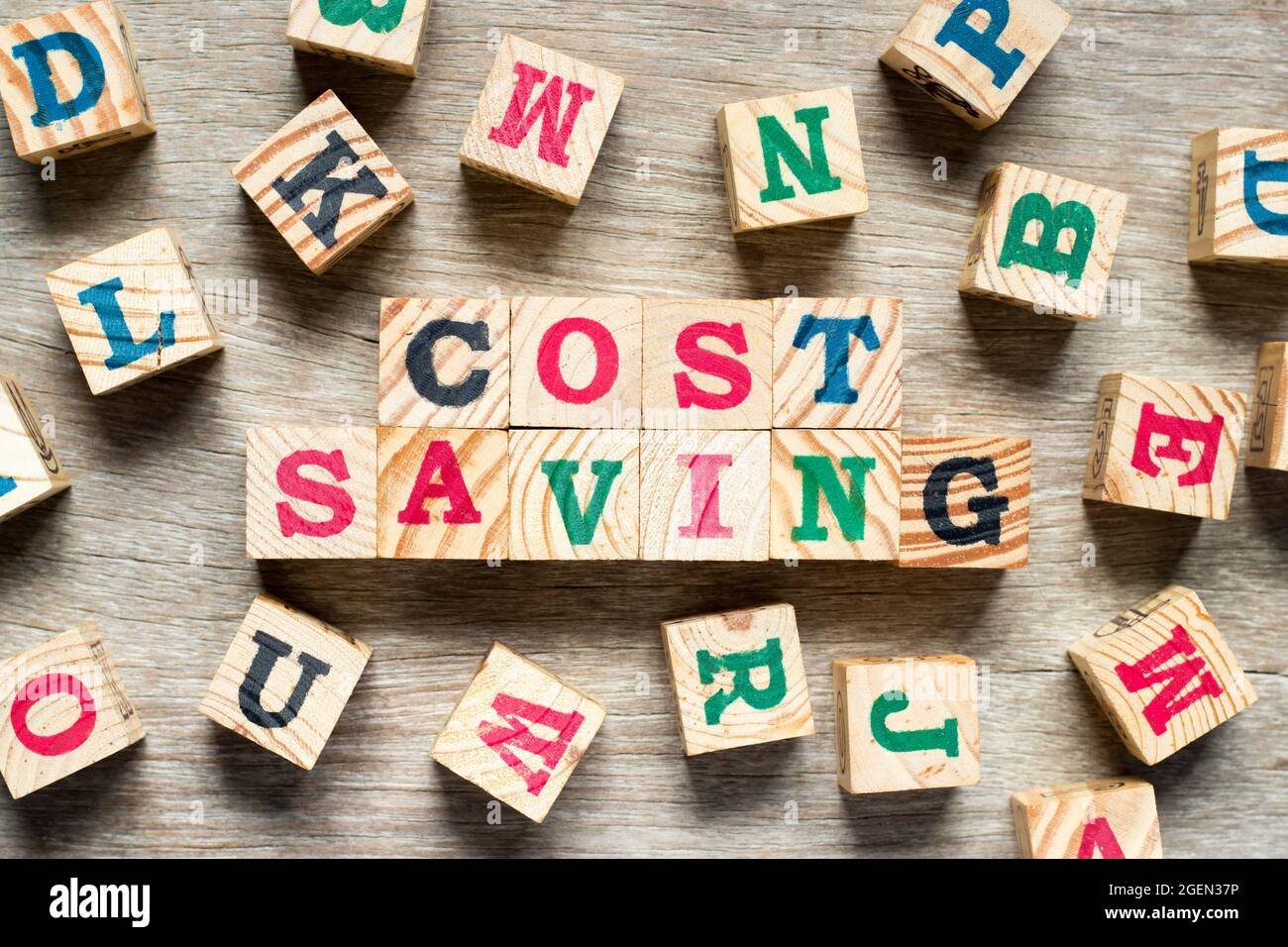 Letter block in word cost saving with another alphabet on wood ...