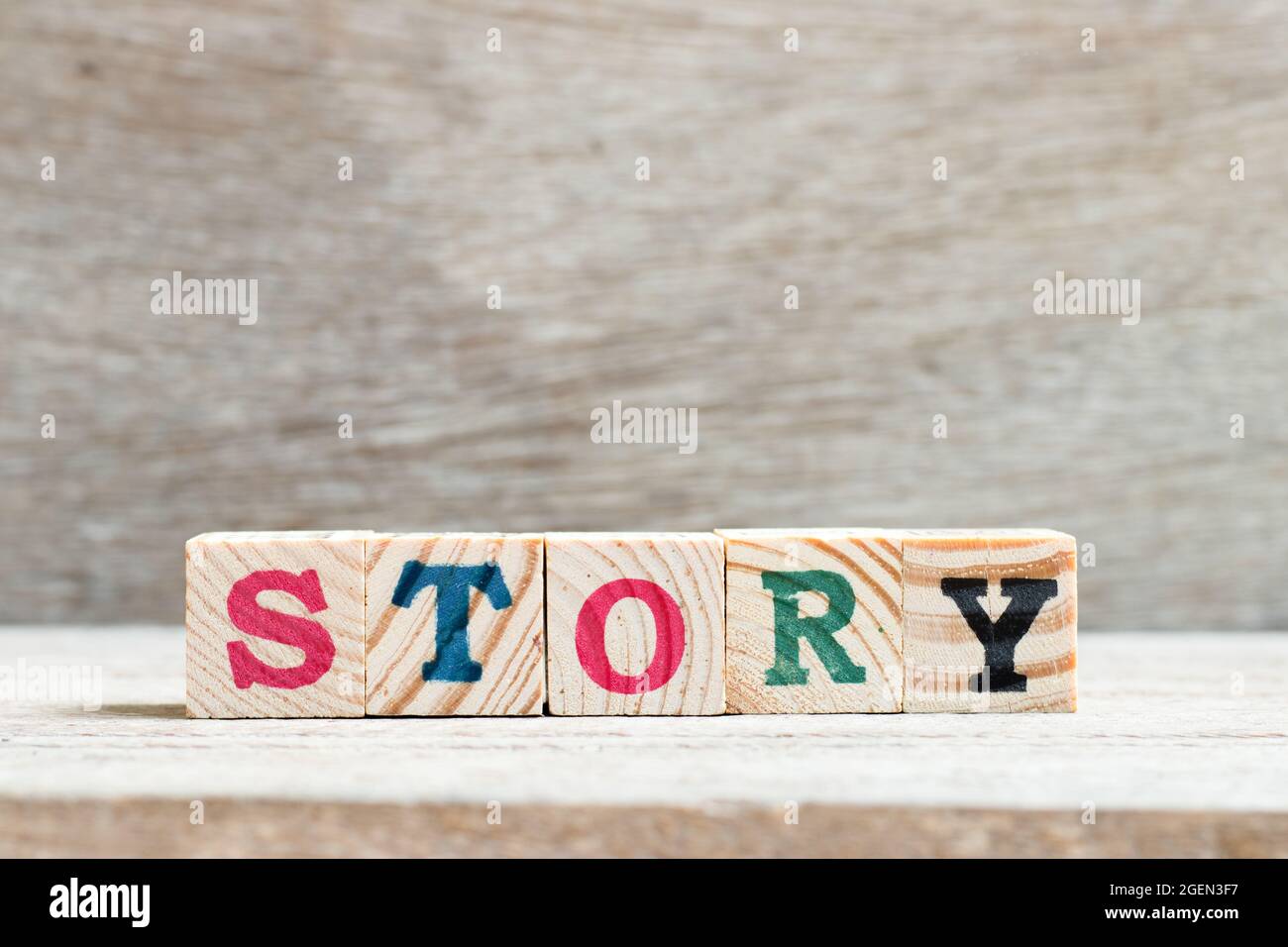 Letter block in word story on wood background Stock Photo - Alamy