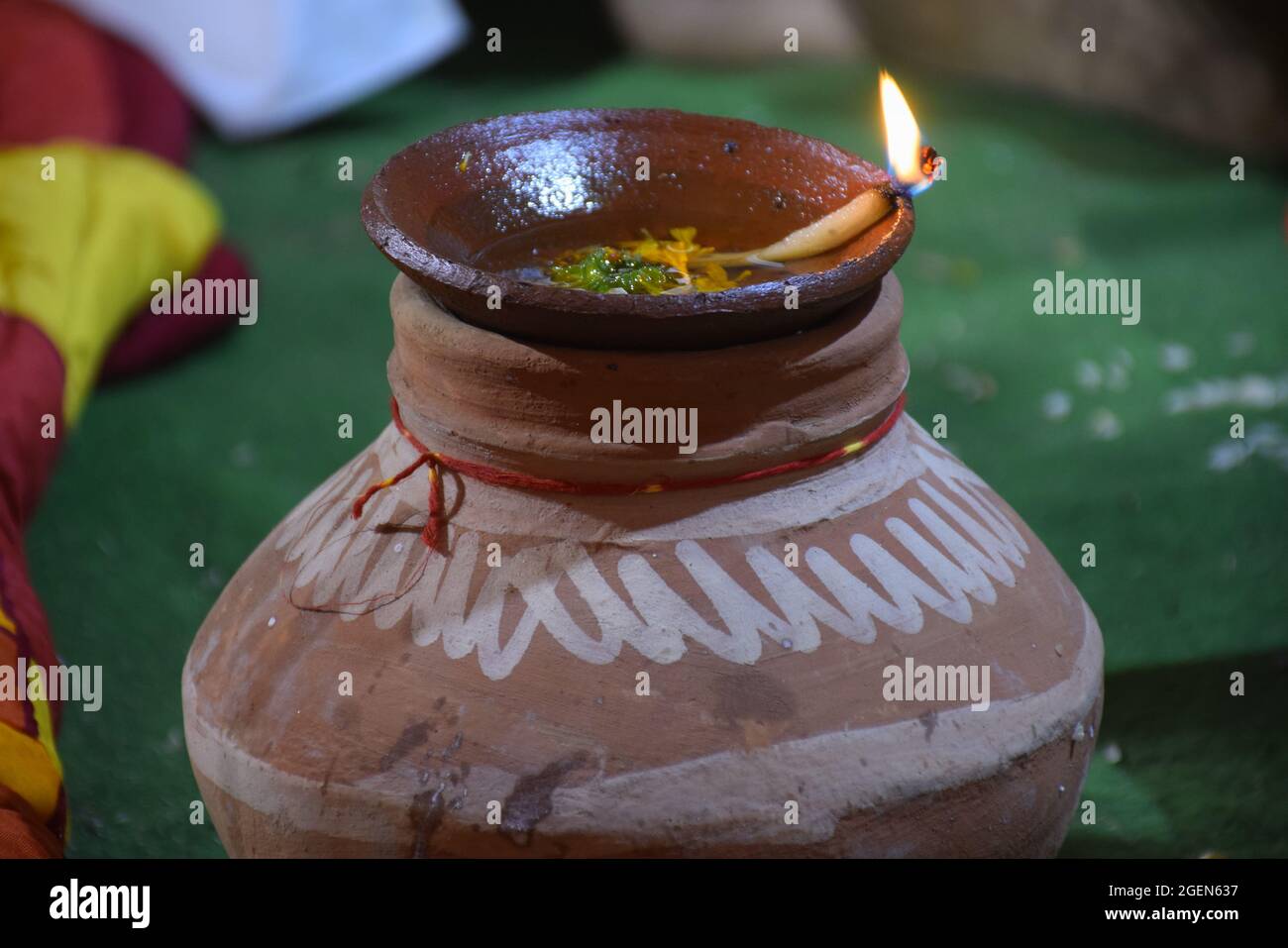 The lamp placed over the ceramics symbolizes Indian culture. oil lamp ...